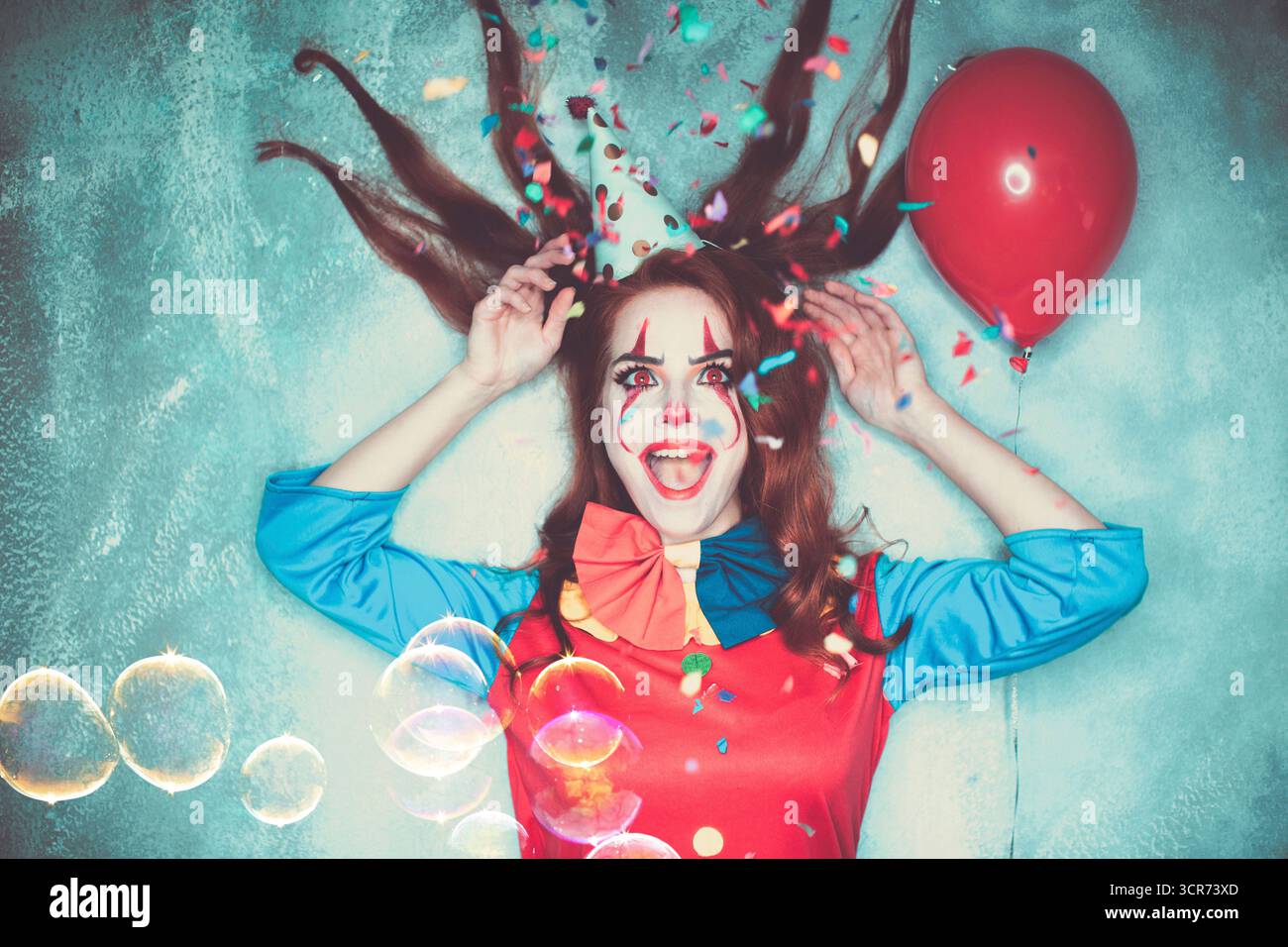 Women in red looking toys hi-res stock photography and images - Alamy