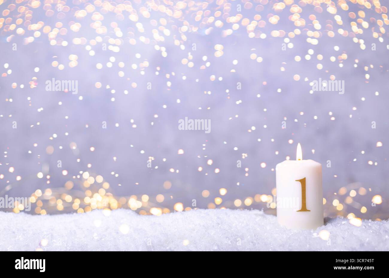 Advent candle and fairy lights in the snow, 1st advent Stock Photo - Alamy