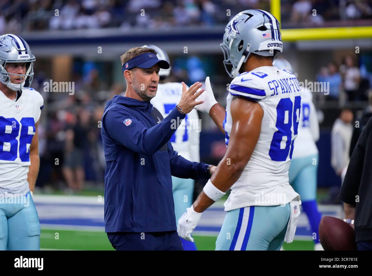 Dallas Cowboys head coach Brian Schottenheimer high fives tight end ...