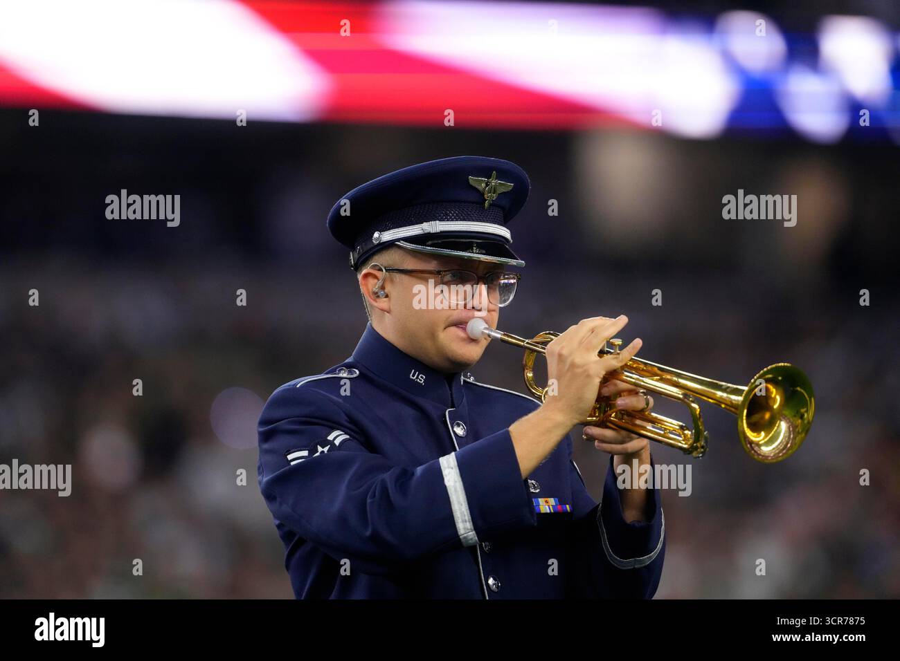 Airman First Class Christopher Stein plays the national anthem on the ...