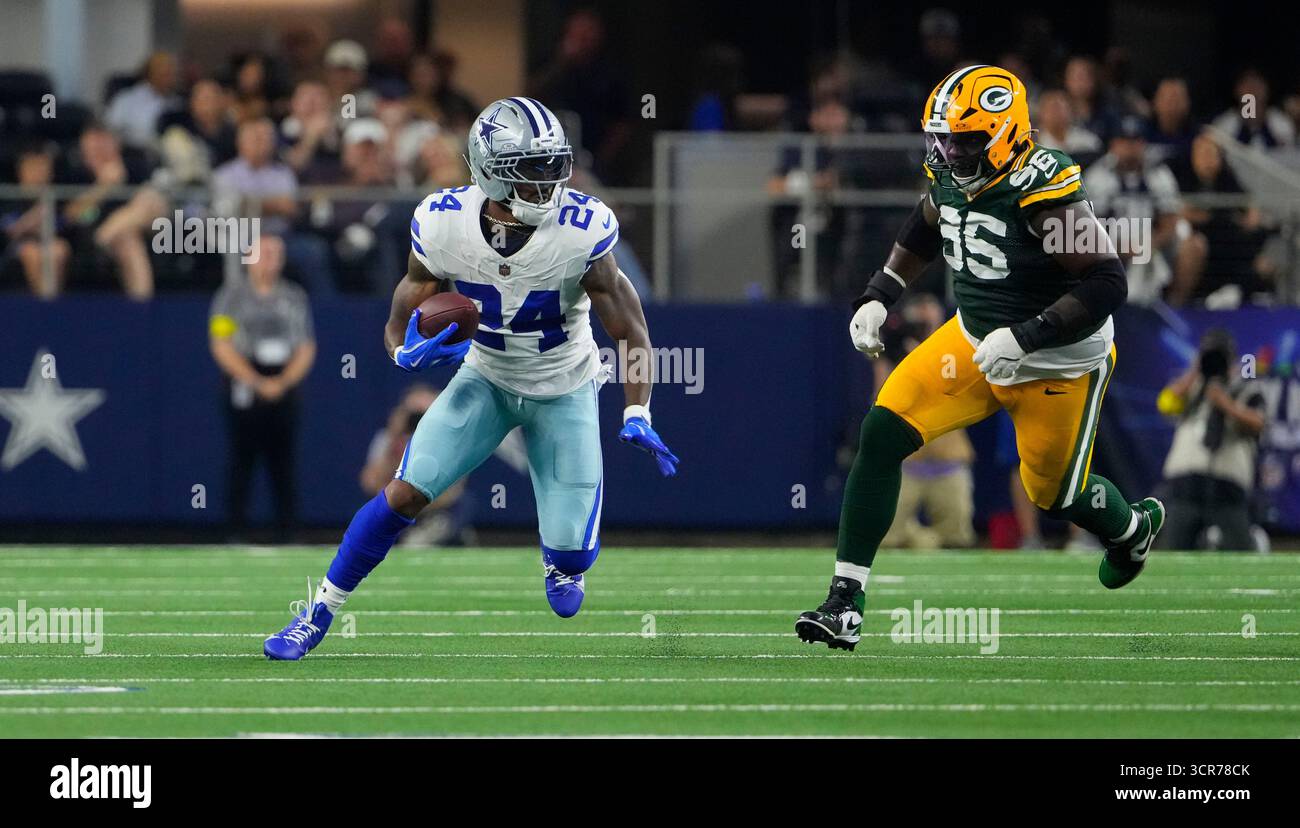 Dallas Cowboys running back Miles Sanders runs away from Green Bay Packers defensive tackle ...