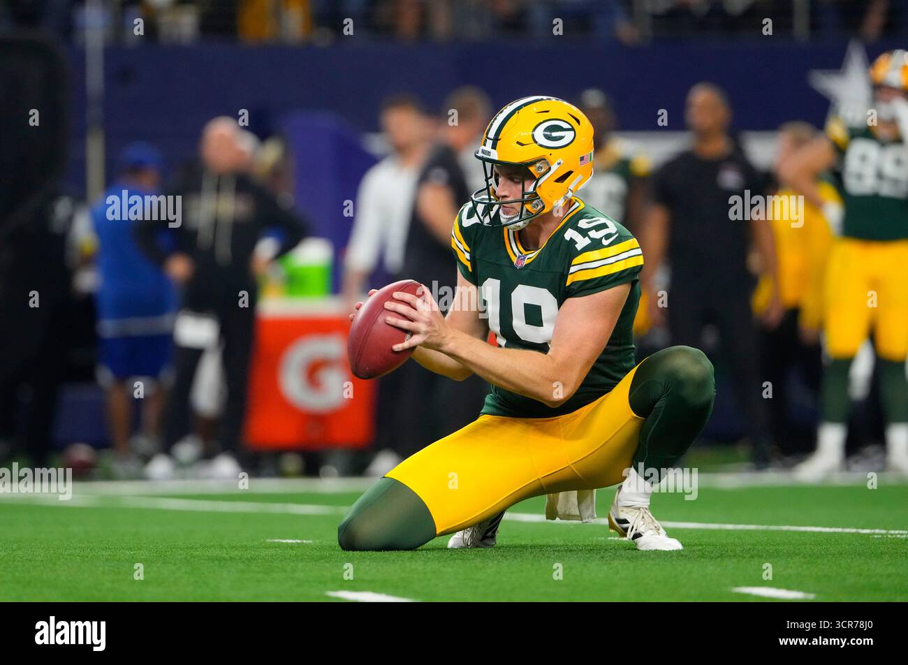 Green Bay Packers punter Daniel Whelan catches the ball to hold for a ...