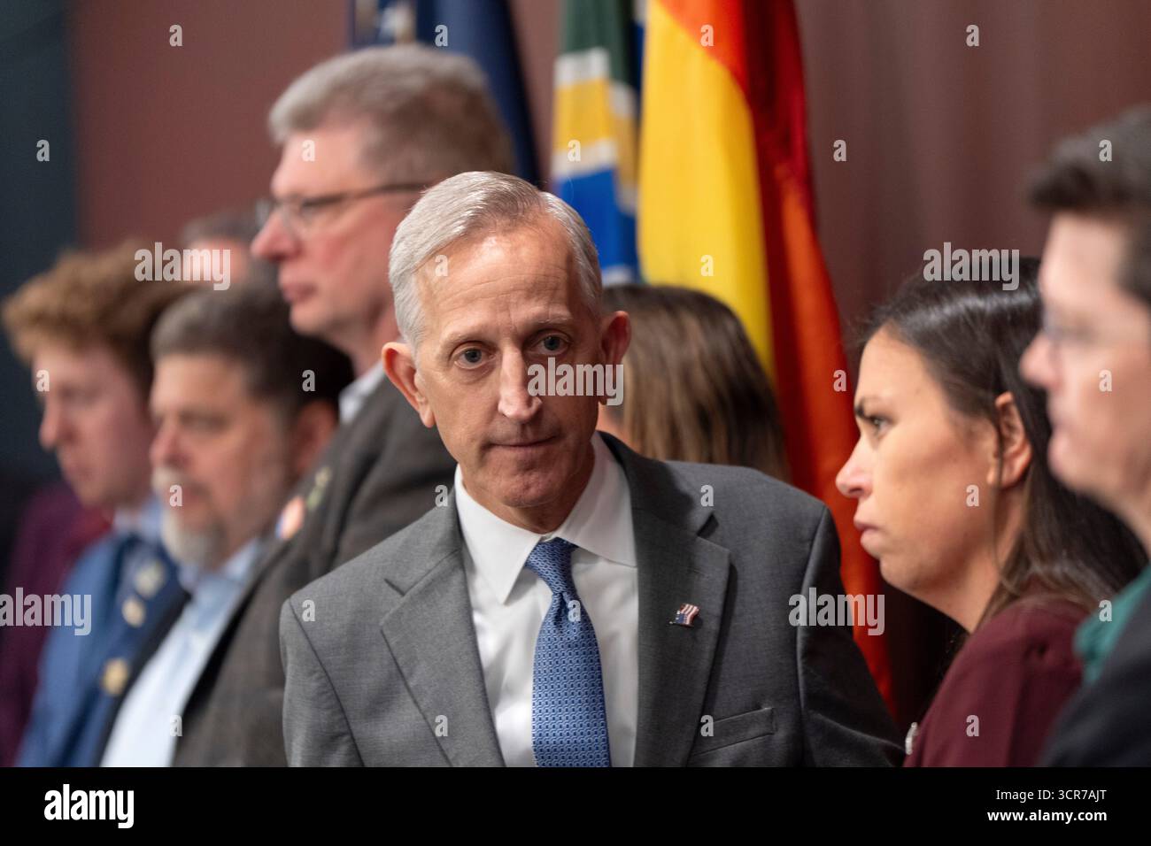 Portland Mayor Keith Wilson, center, walks back to stand with fellow ...