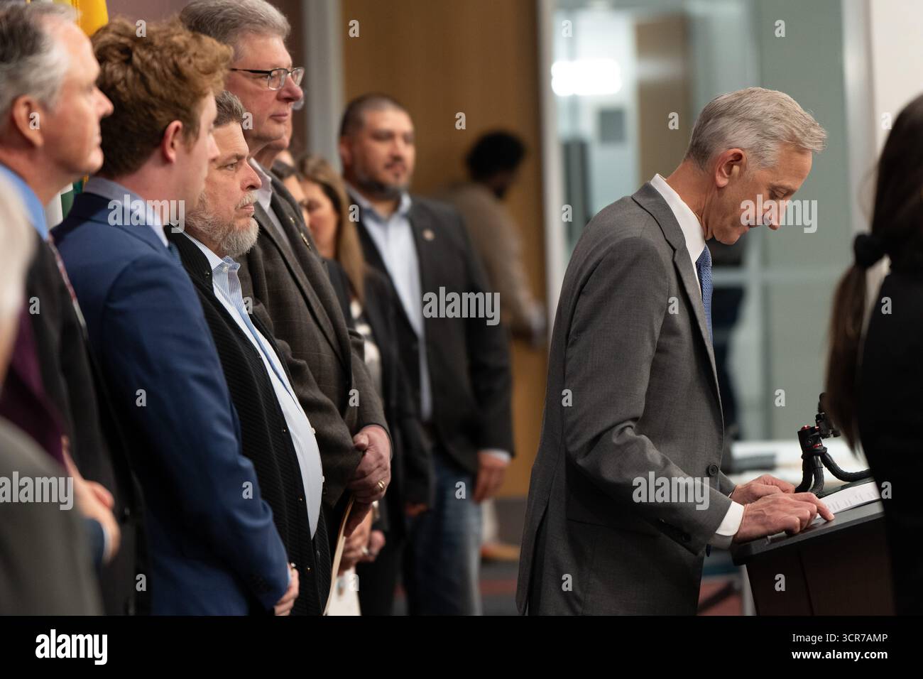 Portland Mayor Keith Wilson, right, pauses before speaking during a ...