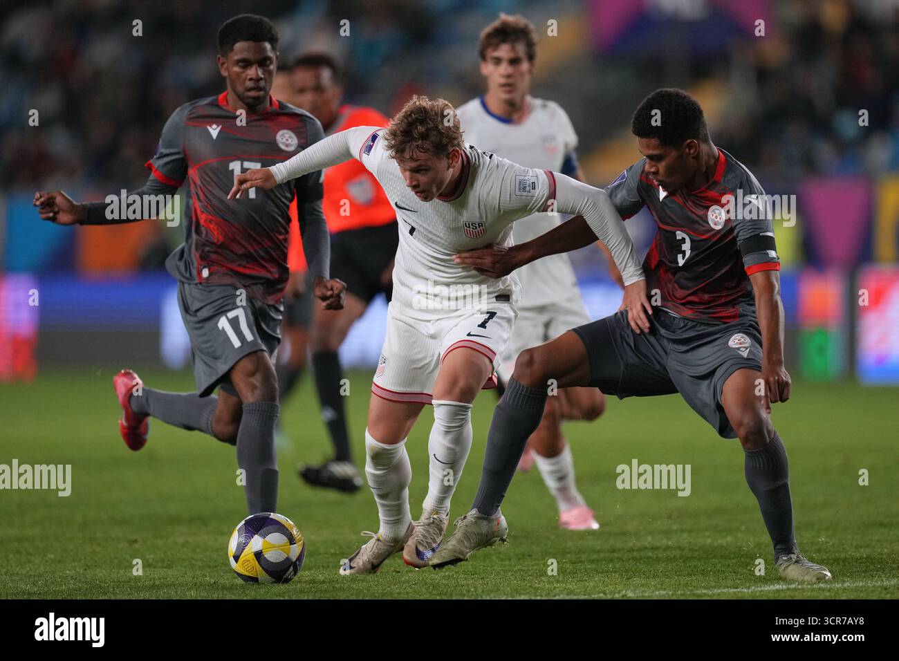 United States' Cole Campbell vies for the ball with New Caledonia's ...