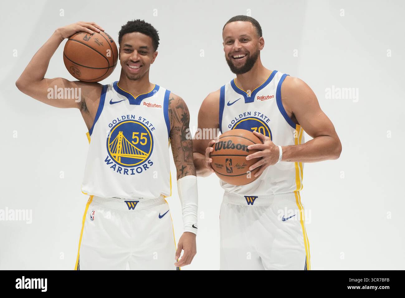 Golden State Warriors' Chance McMillian, left, and guard Stephen Curry ...