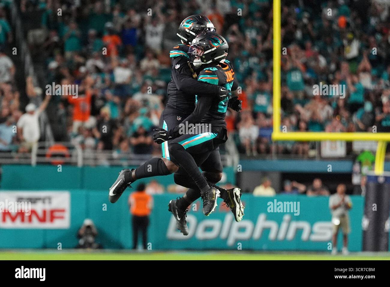 Miami Dolphins cornerback Jack Jones, right, celebrates with a teammate ...