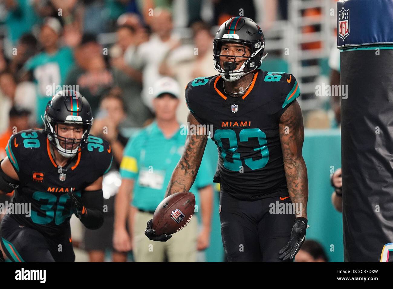 Miami Dolphins' Darren Waller (83) and Alec Ingold (30) celebrate ...