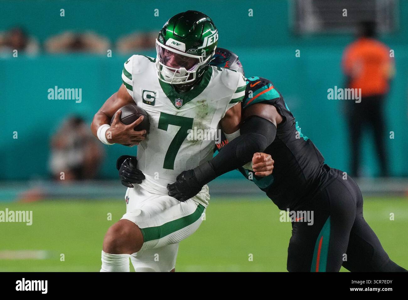 New York Jets quarterback Justin Fields (7) is stopped as he runs the ...