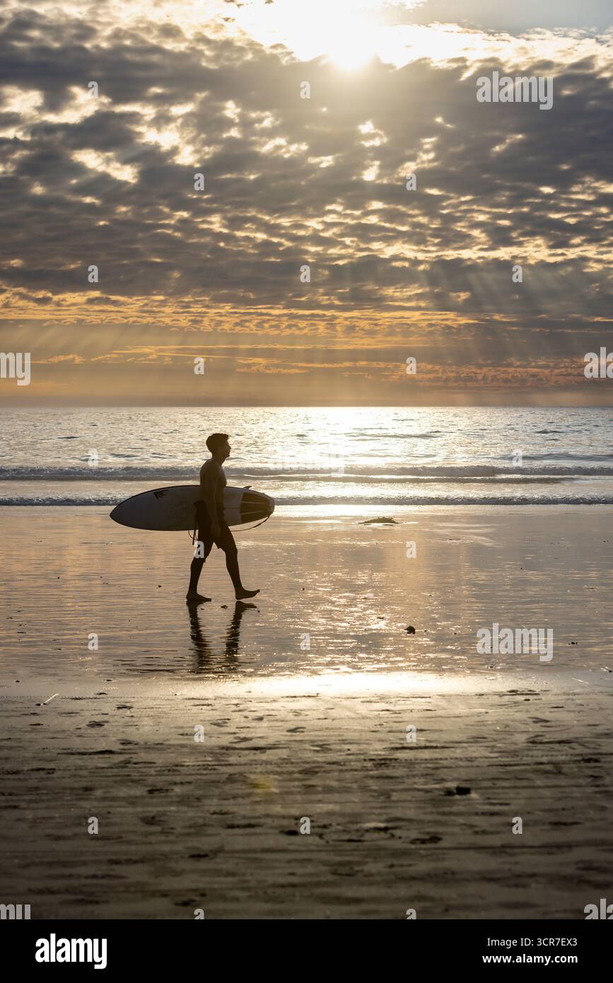 Beach goers take advantage of a beautiful fall late afternoon along ...