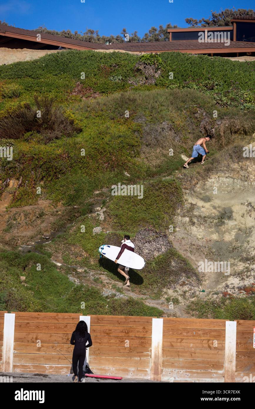 Beach goers take advantage of a beautiful fall late afternoon along ...