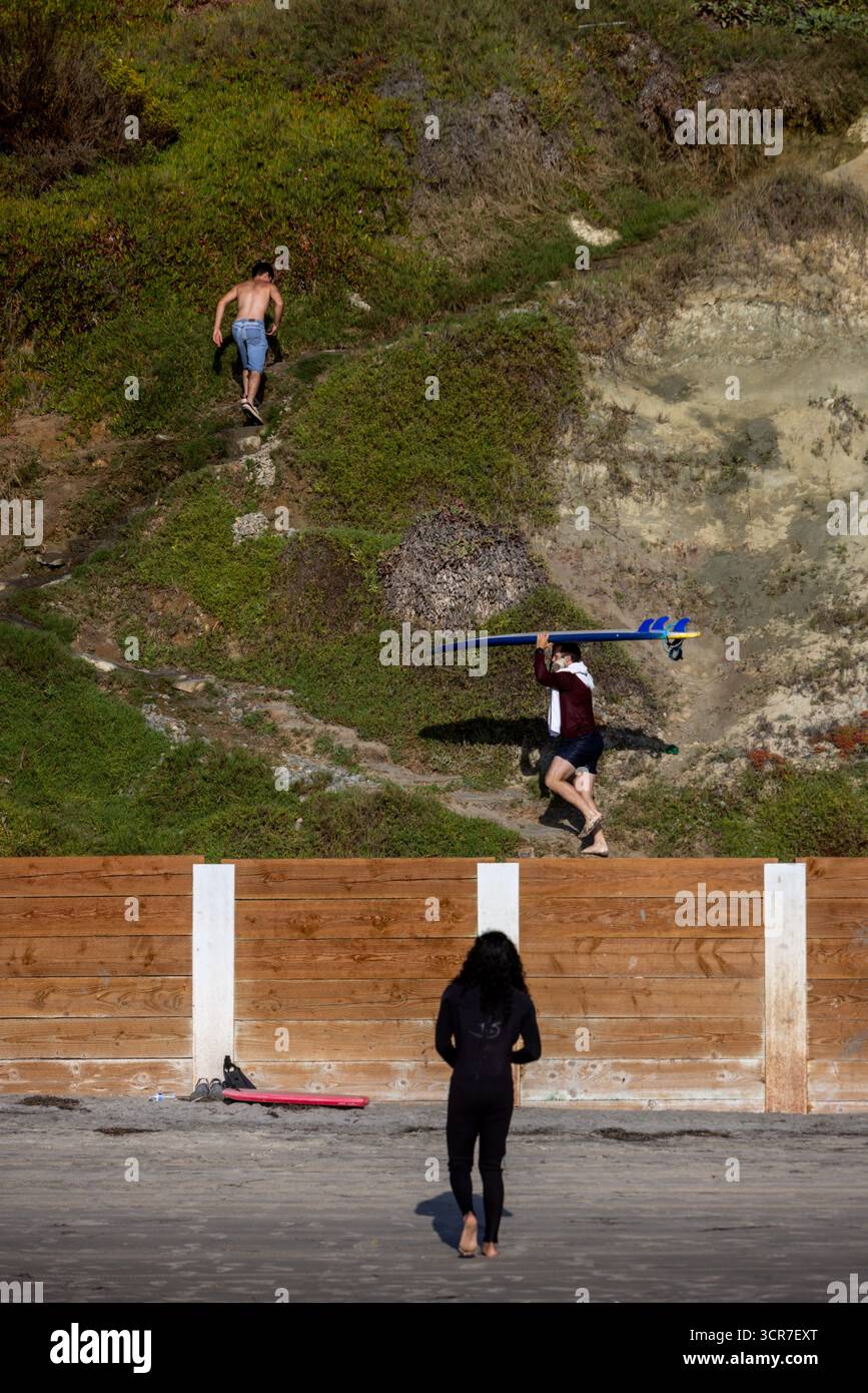 Beach goers take advantage of a beautiful fall late afternoon along ...