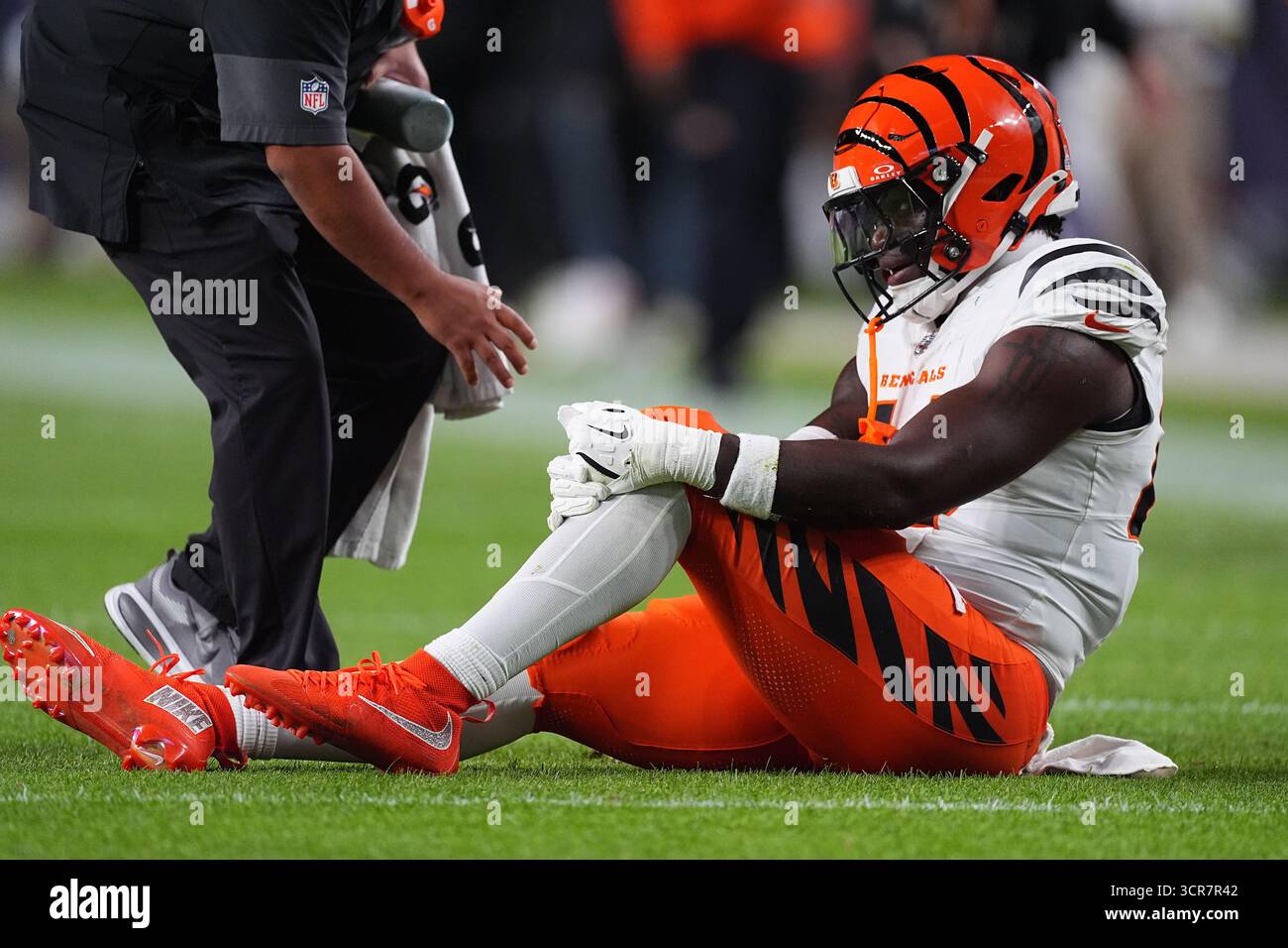 Cincinnati Bengals linebacker Demetrius Knight Jr. (44) holds his knee ...