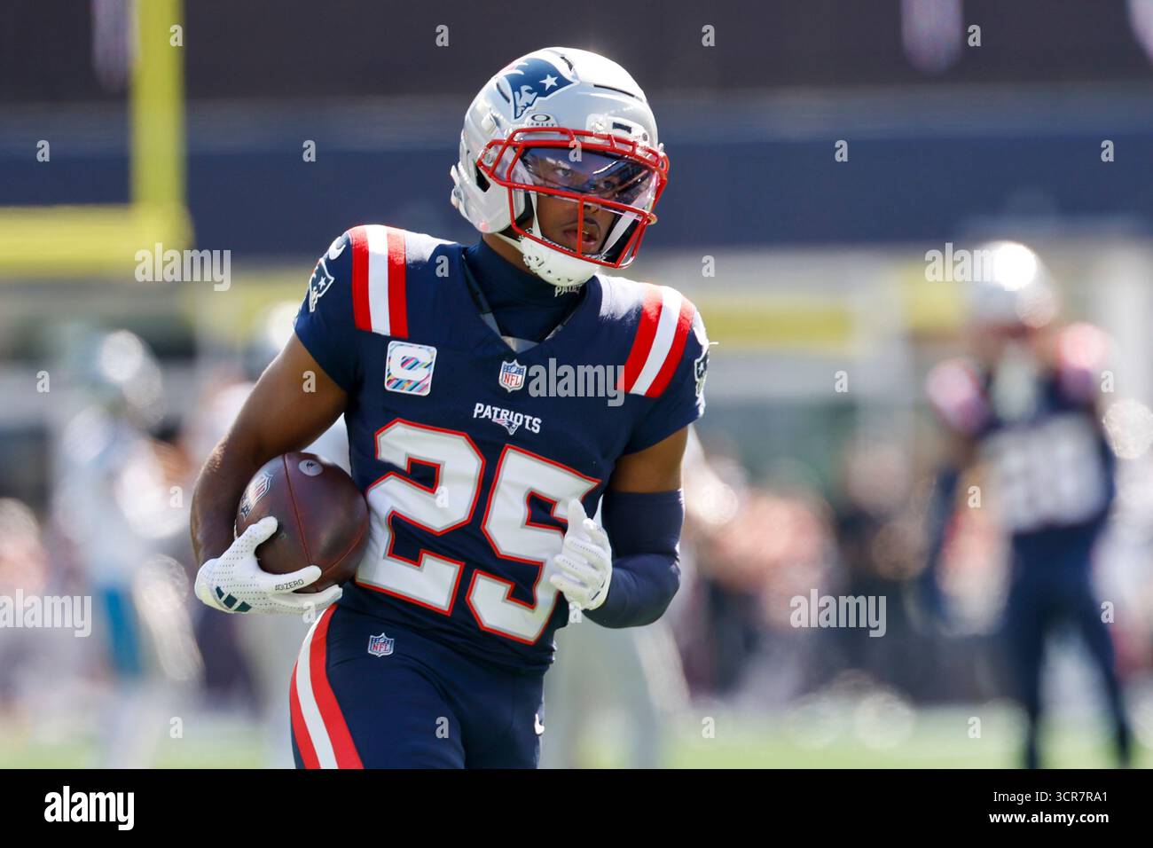 New England Patriots cornerback Marcus Jones (25) warms up prior to the ...