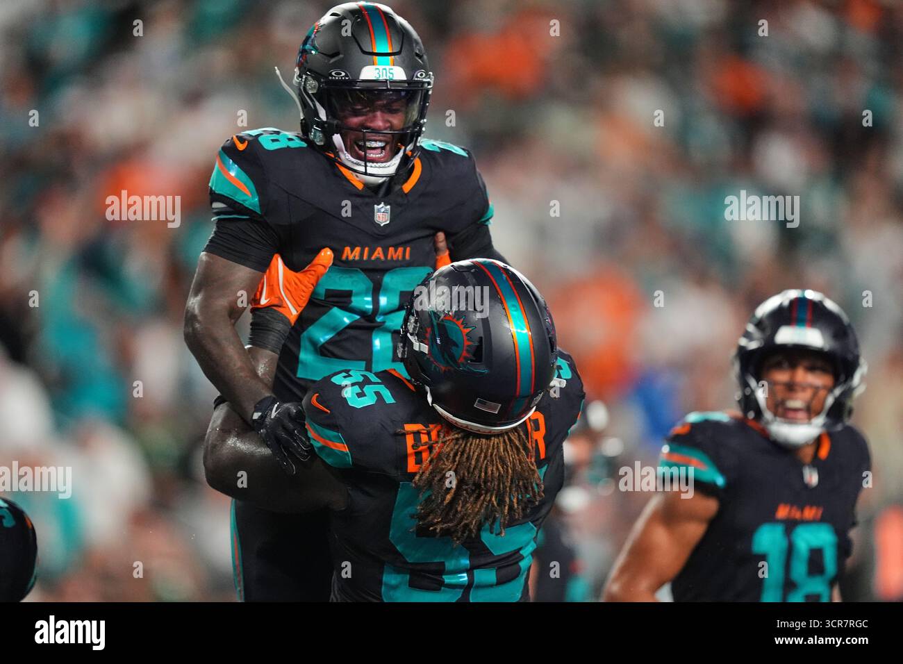 Miami Dolphins running back De'Von Achane (28) celebrates his touchdown ...