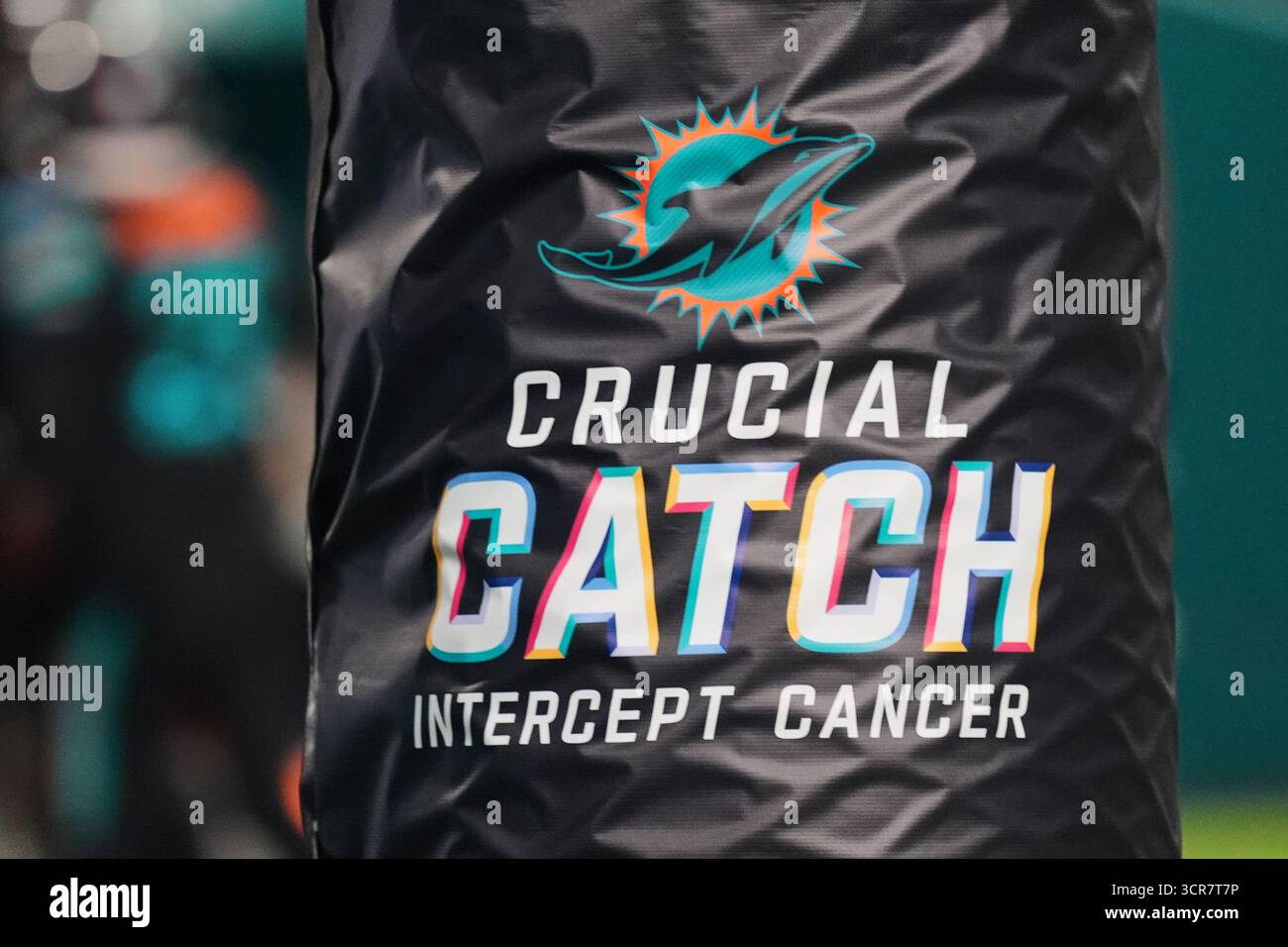The goal post wrap shows the "Crucial Catch, Intercept Cancer ...