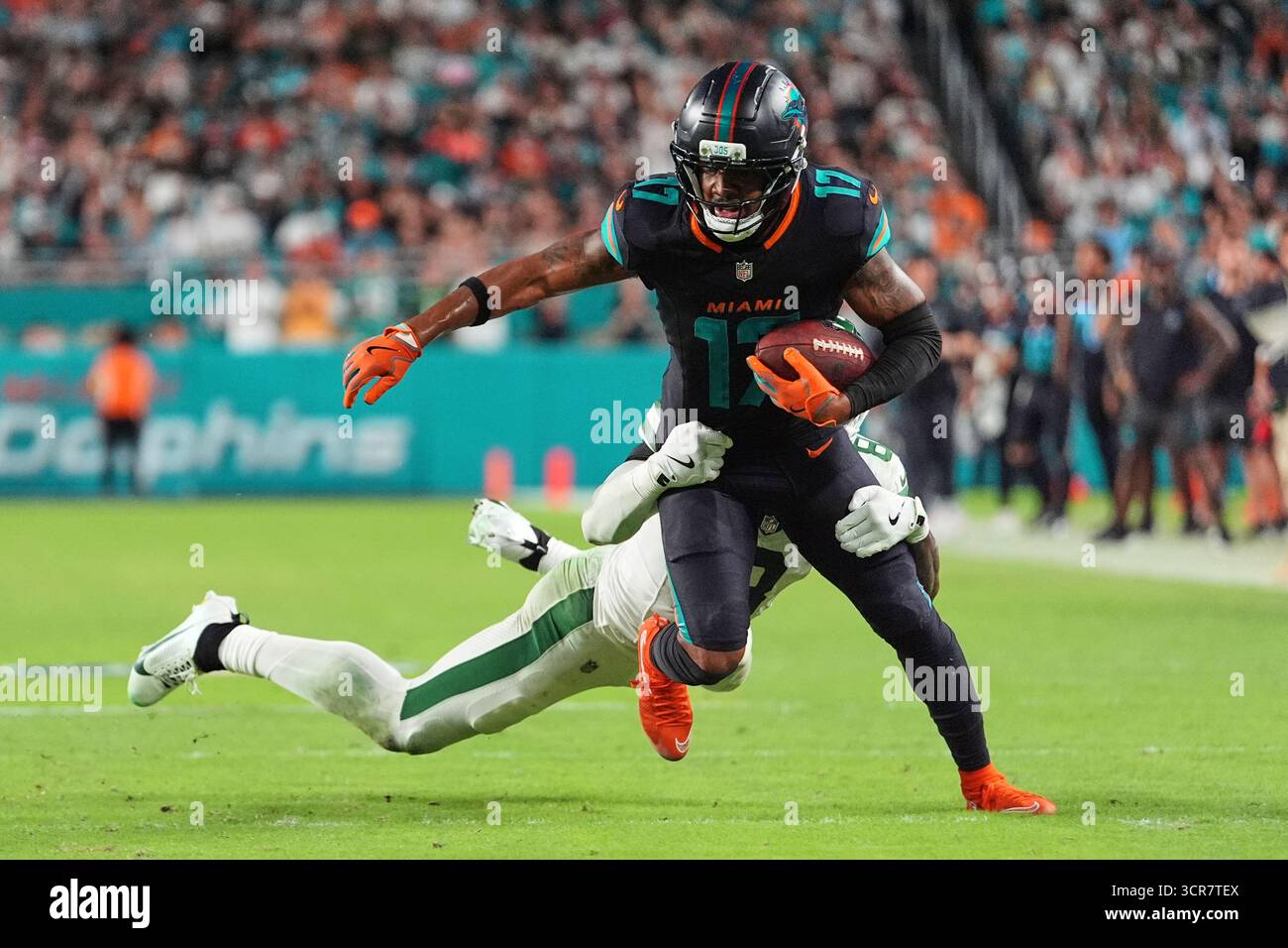 Miami Dolphins wide receiver Jaylen Waddle (17) is tackled by New York ...