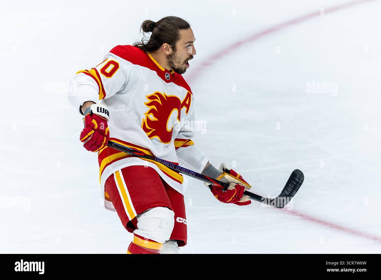 Calgary Flames left wing Ryan Lomberg warms up before an NHL hockey ...