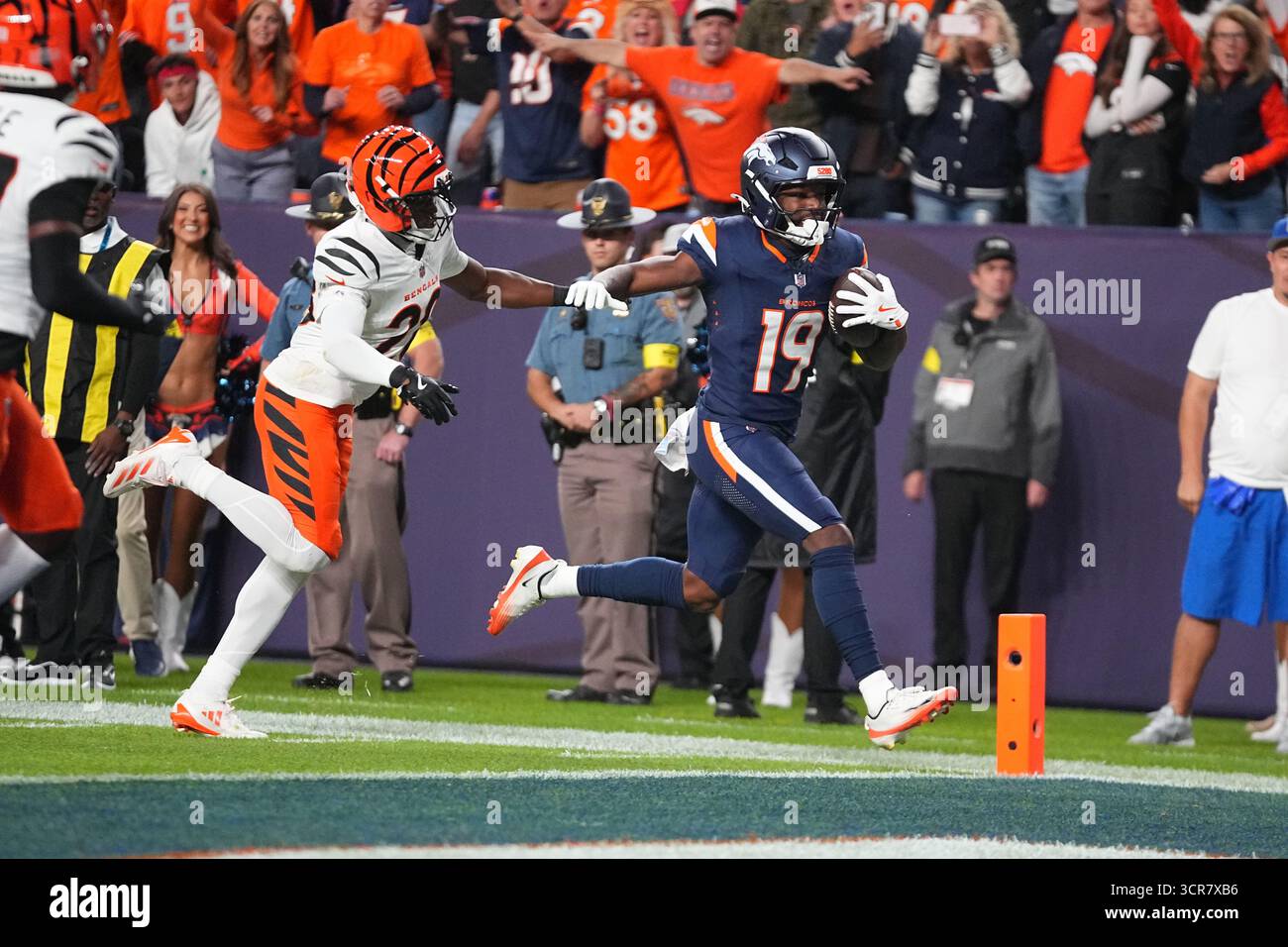 Denver Broncos wide receiver Marvin Mims Jr. (19) runs for a touchdown against the Cincinnati ...