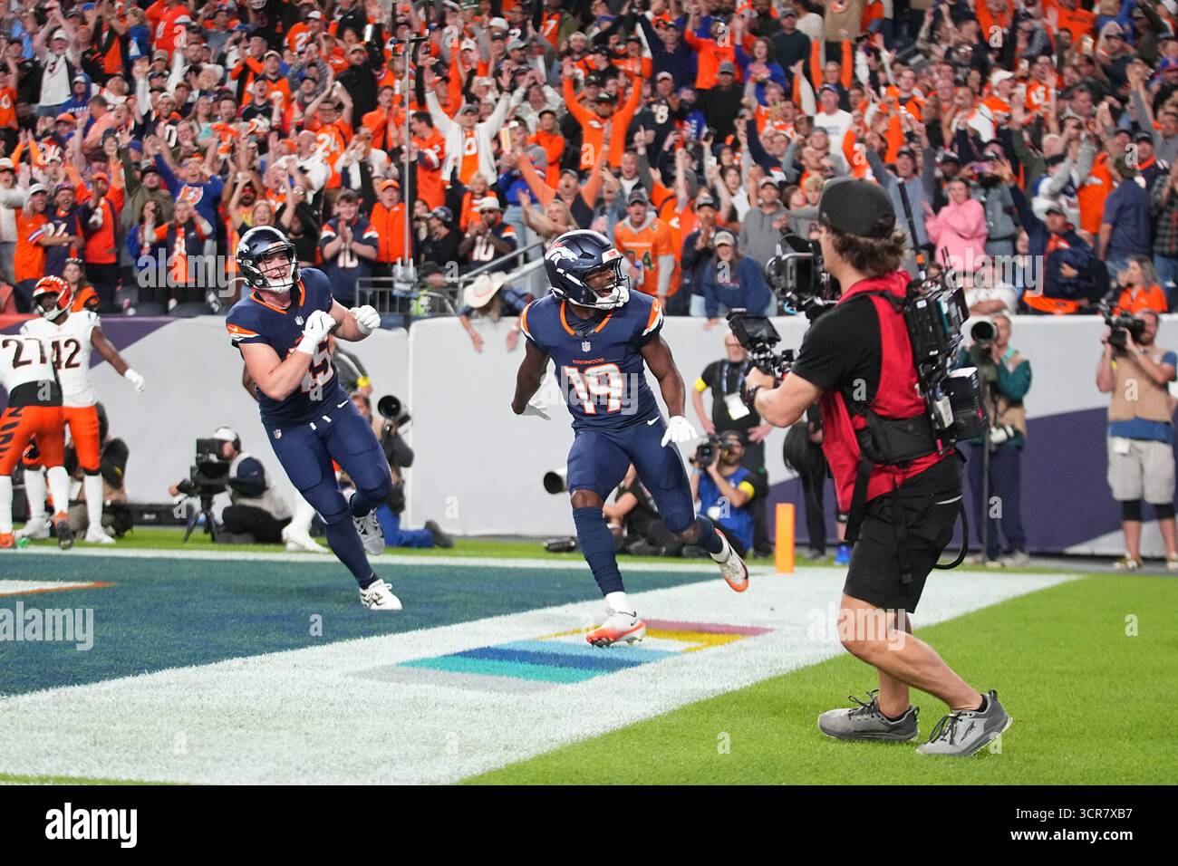 Denver Broncos wide receiver Marvin Mims Jr. (19) runs for a touchdown against the Cincinnati ...