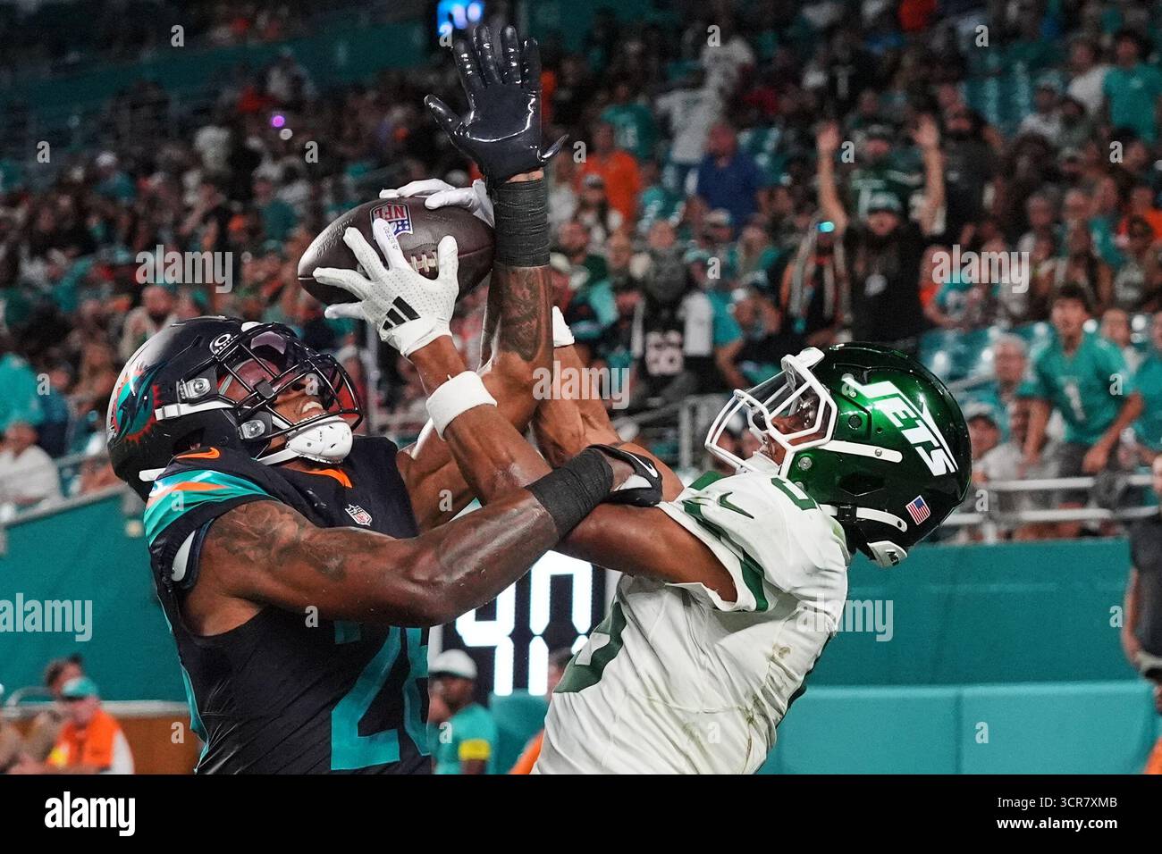New York Jets wide receiver Garrett Wilson, right, catches a touchdown ...