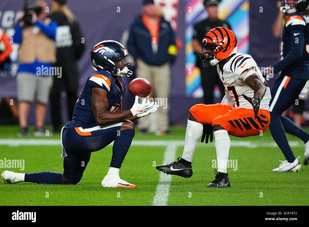 Denver Broncos wide receiver Marvin Mims Jr. (19) bobbles a fair catch near Cincinnati Bengals ...