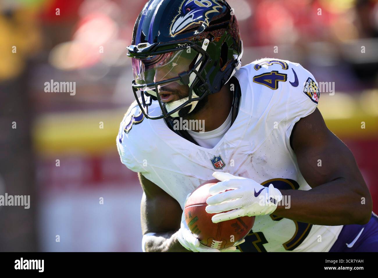 Baltimore Ravens running back Justice Hill runs back a kickoff during ...