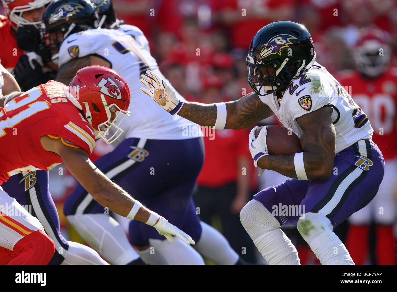 Baltimore Ravens running back Derrick Henry (22) tries to avoid the ...