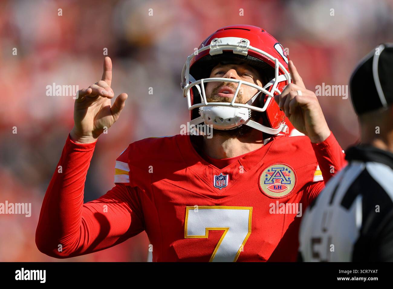 Kansas City Chiefs kicker Harrison Butker points to the sky after ...
