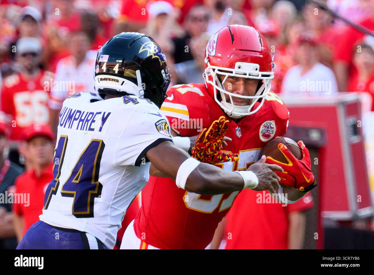Kansas City Chiefs tight end Travis Kelce (87) tries to fend off Baltimore Ravens safety Kyle ...