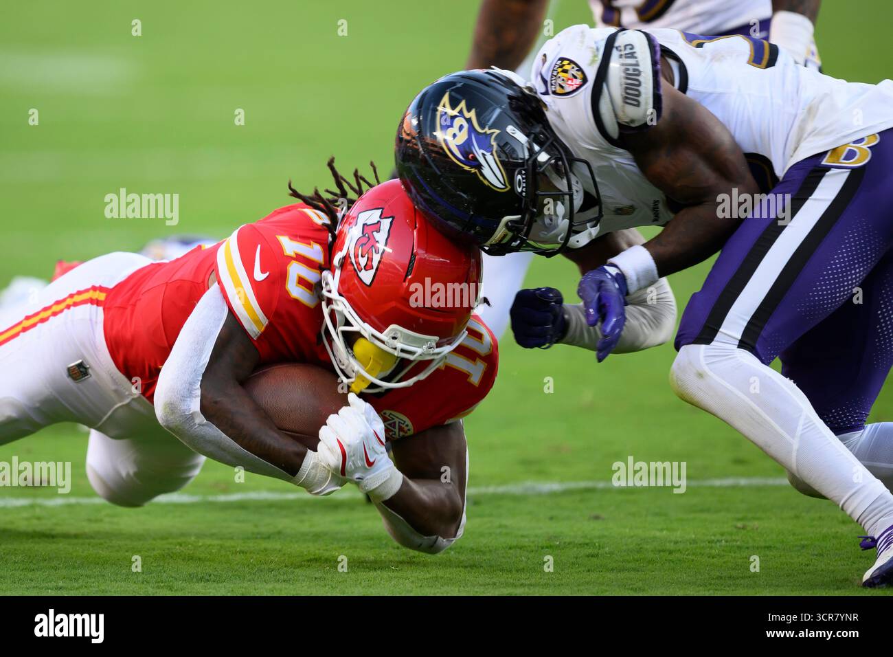 Baltimore Ravens cornerback Keyon Martin, right, tackles Kansas City ...