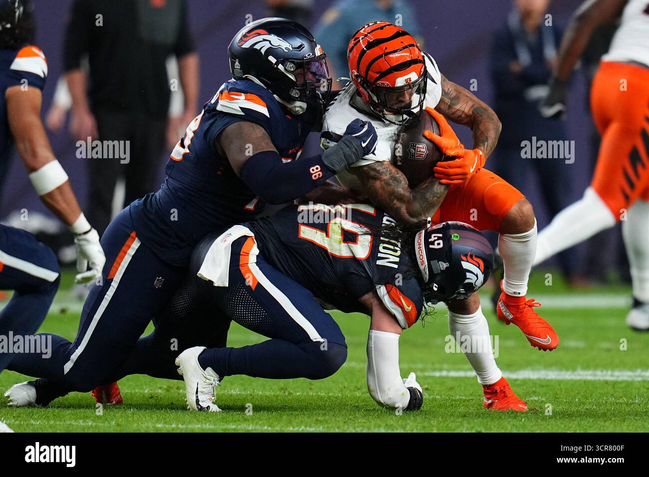 Cincinnati Bengals running back Chase Brown (30) is tackled by ...