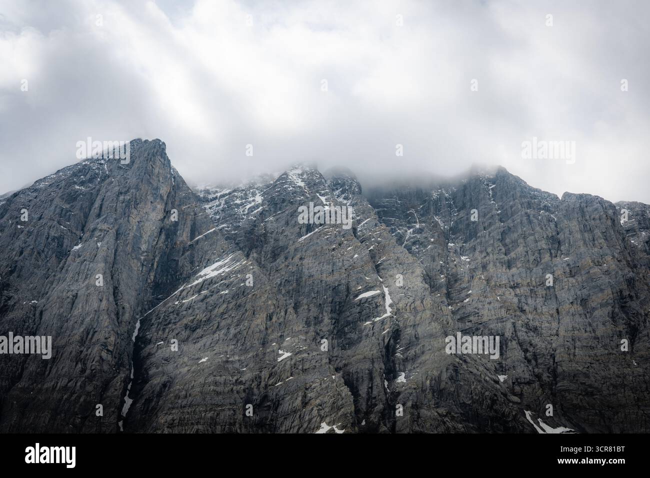 Towering peaks partially hi-res stock photography and images - Alamy