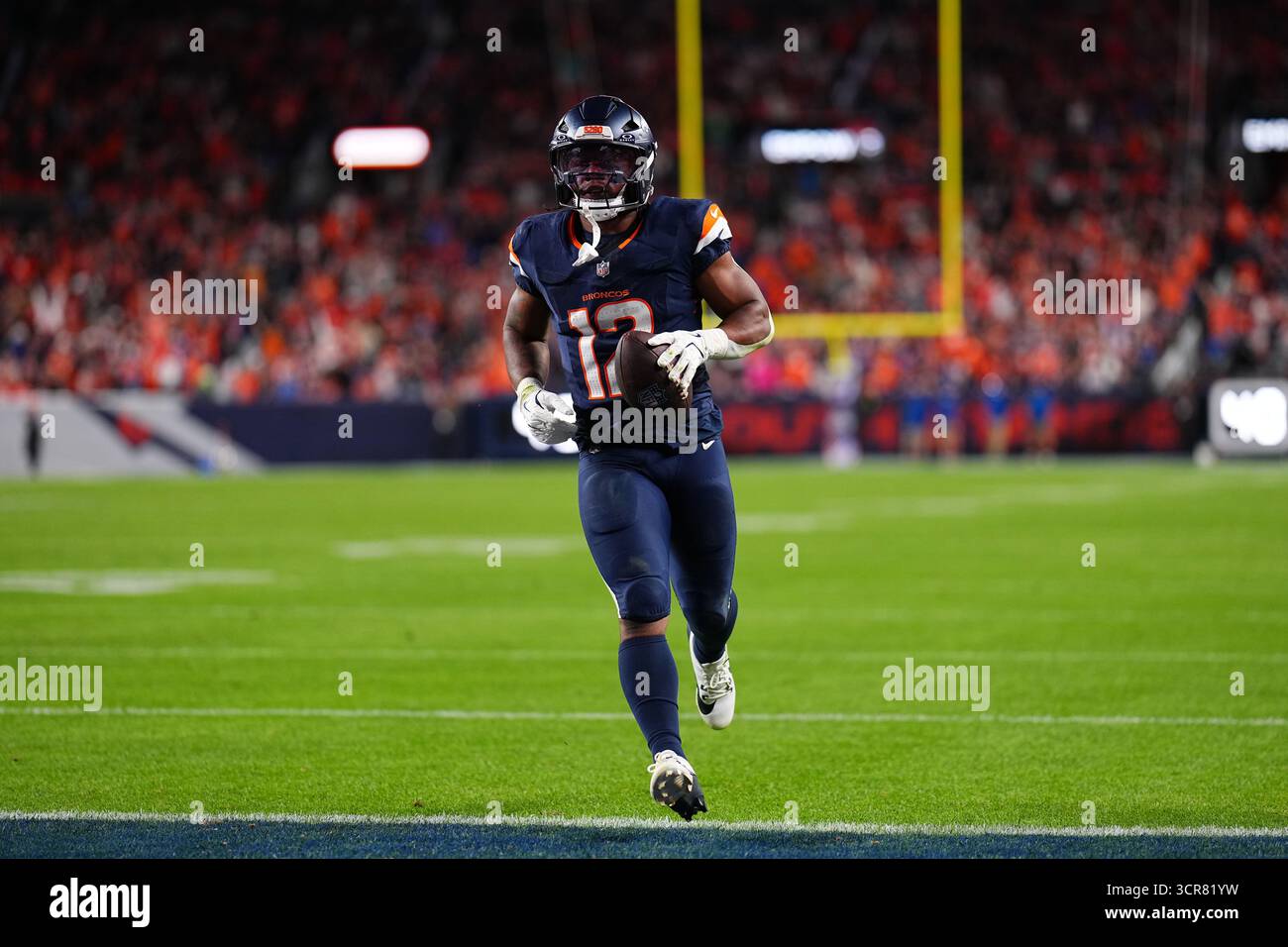 Denver Broncos running back RJ Harvey (12) scores a touchdown against ...