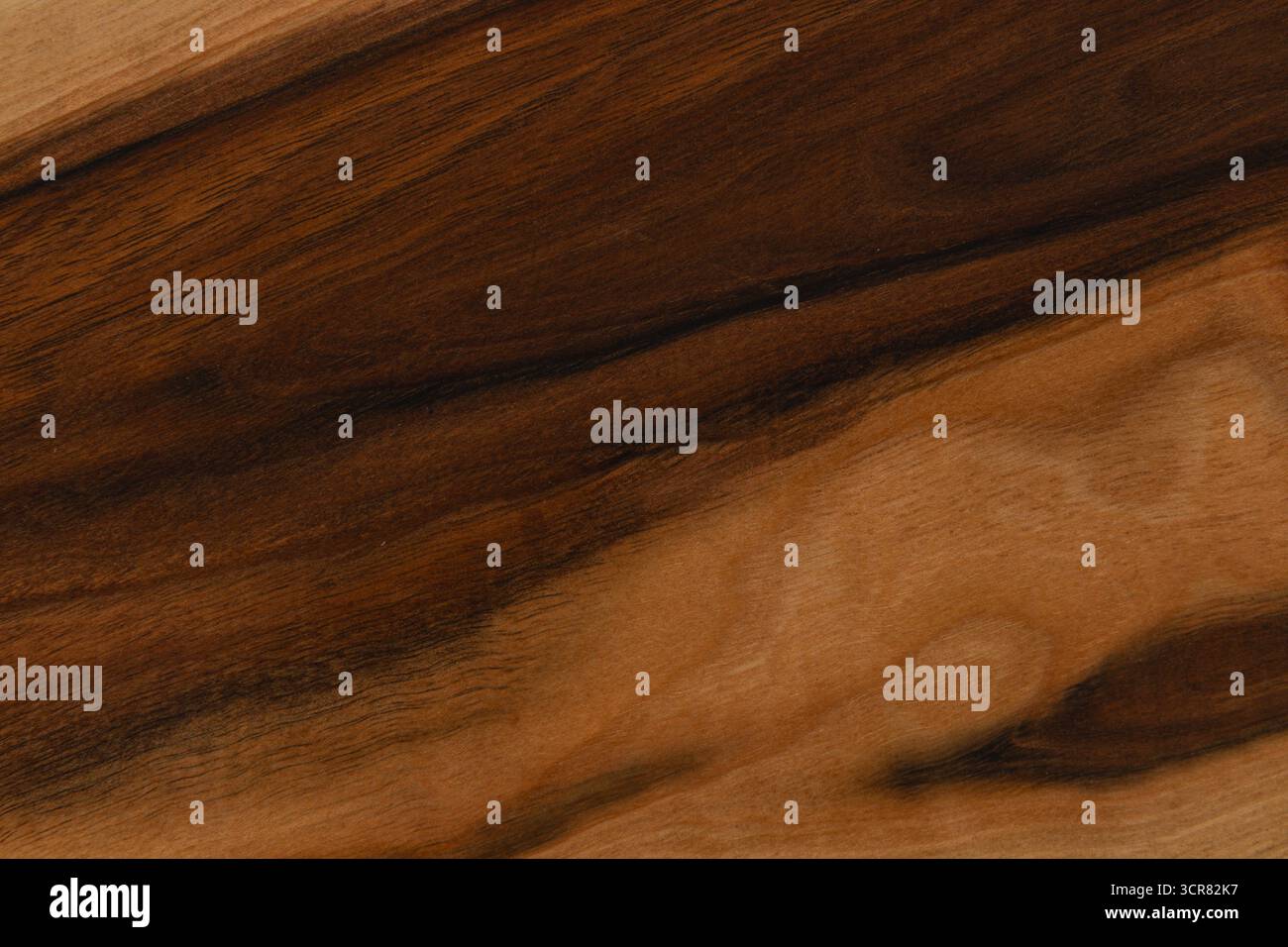 A close-up view of polished wood grain reveals intricate patterns and ...