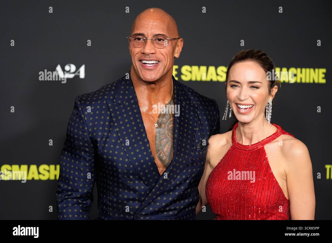 Dwayne Johnson, left, and Emily Blunt, cast members in "The Smashing ...