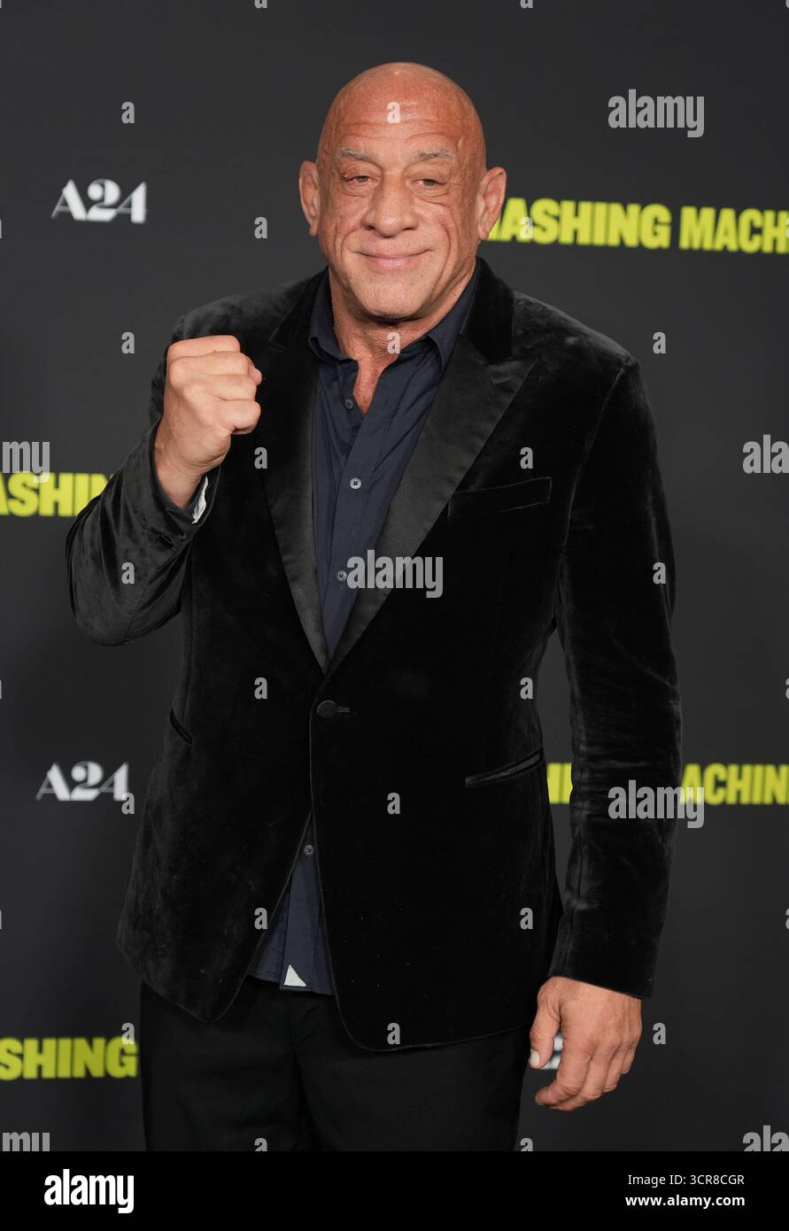 Mark Coleman poses at the premiere of the film "The Smashing Machine ...