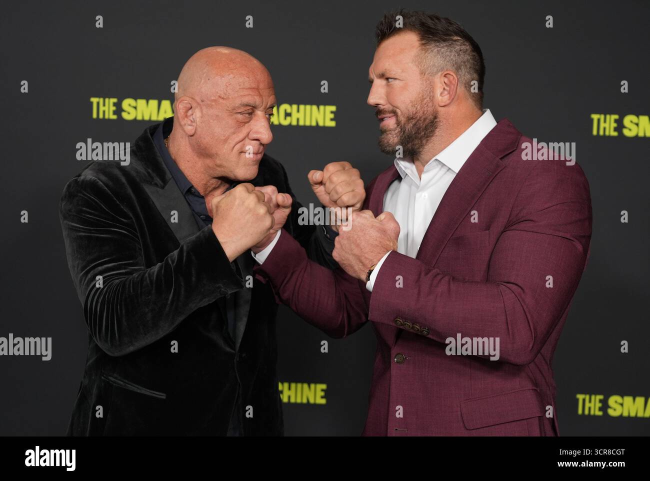 Mark Coleman, left, and Ryan Bader pose together at the premiere of the ...