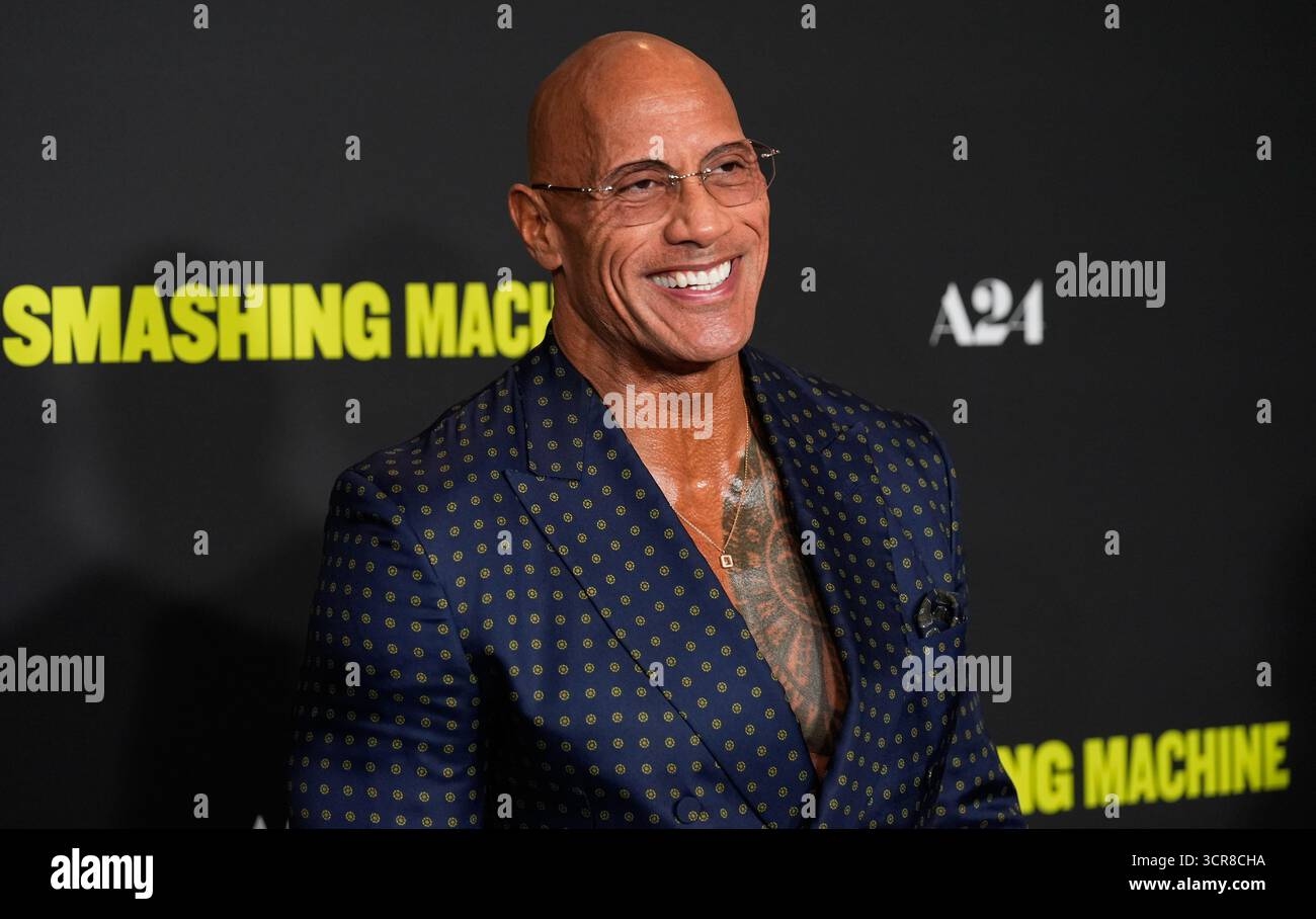 Dwayne Johnson poses at the premiere of the film "The Smashing Machine ...