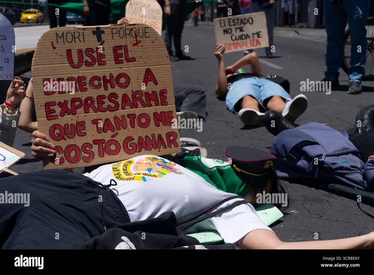 Protesters holding placards perform during the demonstration. Seven ...