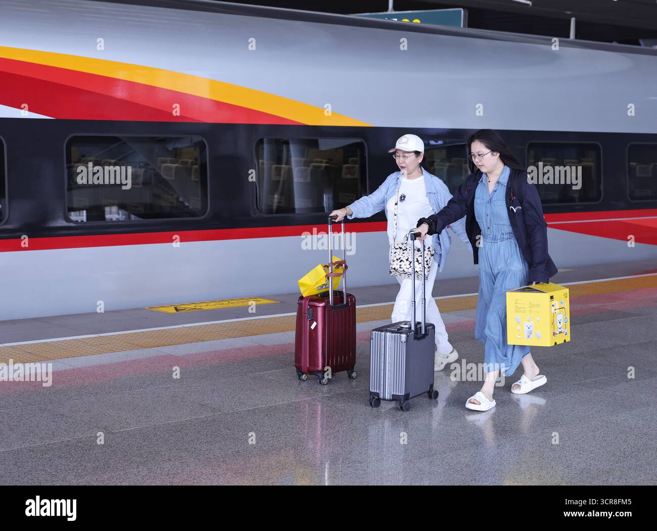 Passengers are seen at Wuhan railway station in Wuhan City, central ...