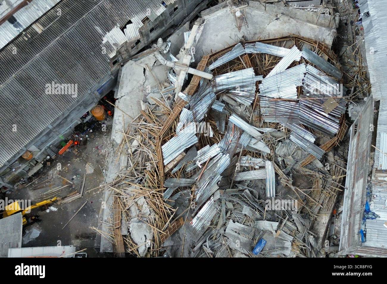 This aerial shot taken with a drone shows the rubble of a building that ...