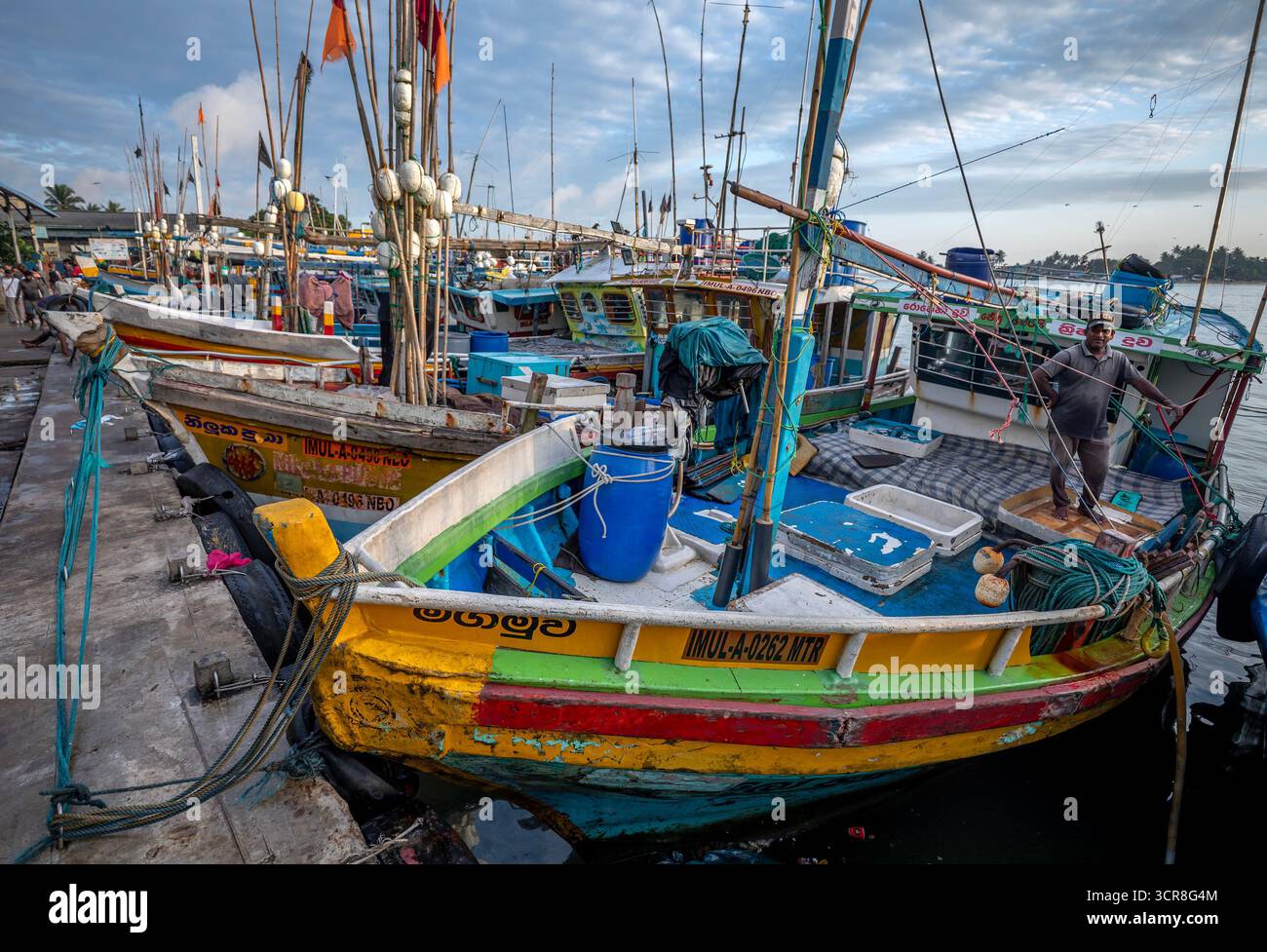 NEGOMBO, SRI LANKA - JULY 22, 2024 : A row of deep sea fishing trawlers ...