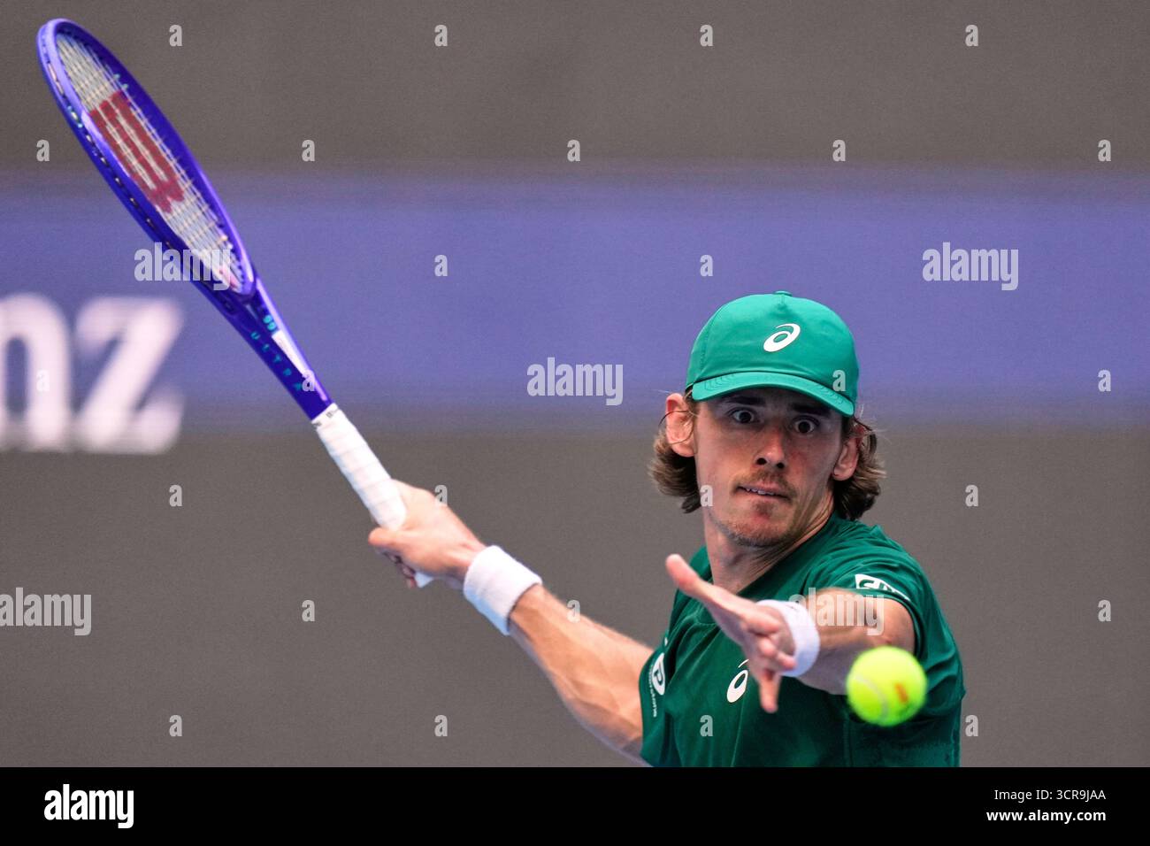 Alex De Minaur of Australia returns a forehand shot to Jannik Sinner of ...