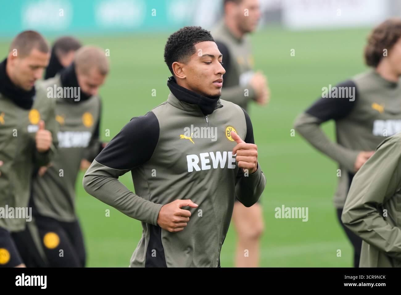 Dortmund's Jobe Bellingham exercises with teammates during a training ...