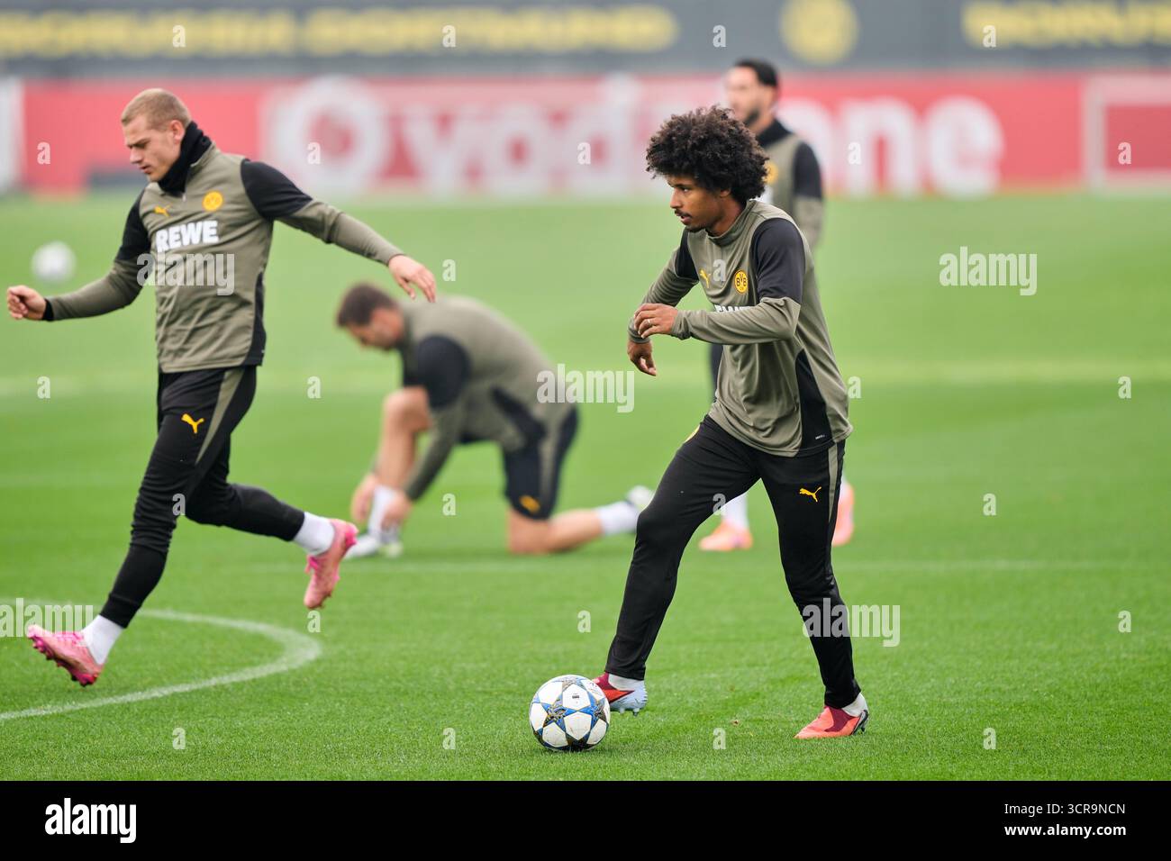 Dortmund's Karim Adeyemi exercises with teammates during a training ...