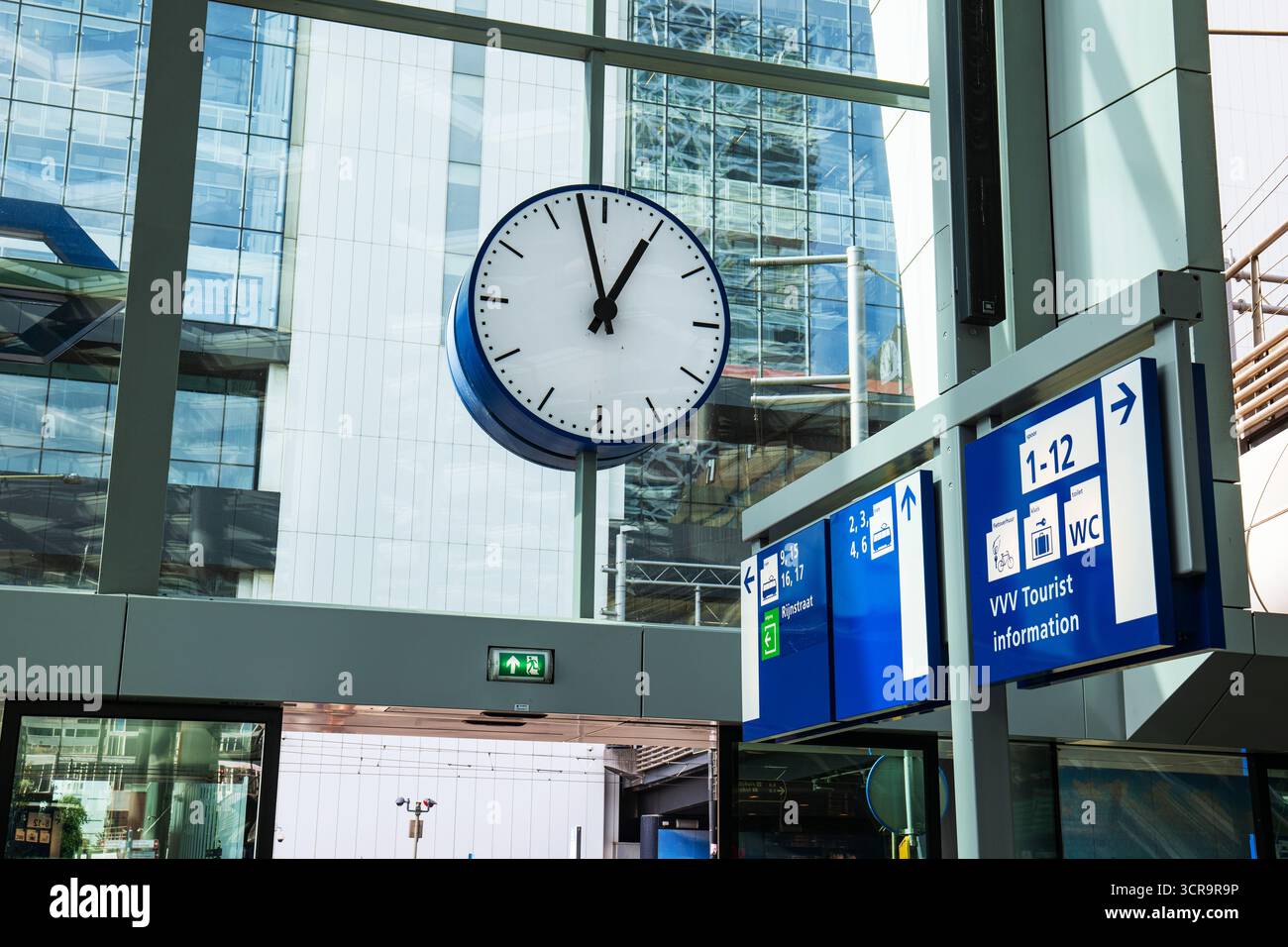 The Hague, Netherlands, August 27, 2025. Large, analog suspended clock ...