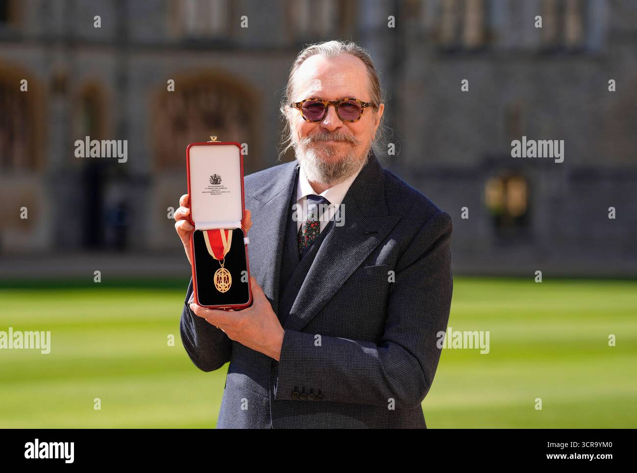Sir Gary Oldman after being made a Knight Bachelor at an investiture ceremony at Windsor Castle ...
