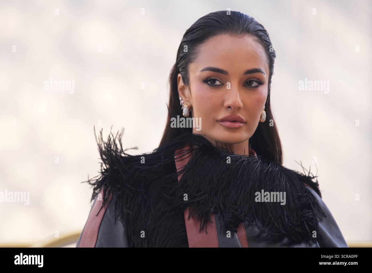 Amina Muaddi poses before the Louis Vuitton Spring/Summer 2026 collection presented in Paris ...