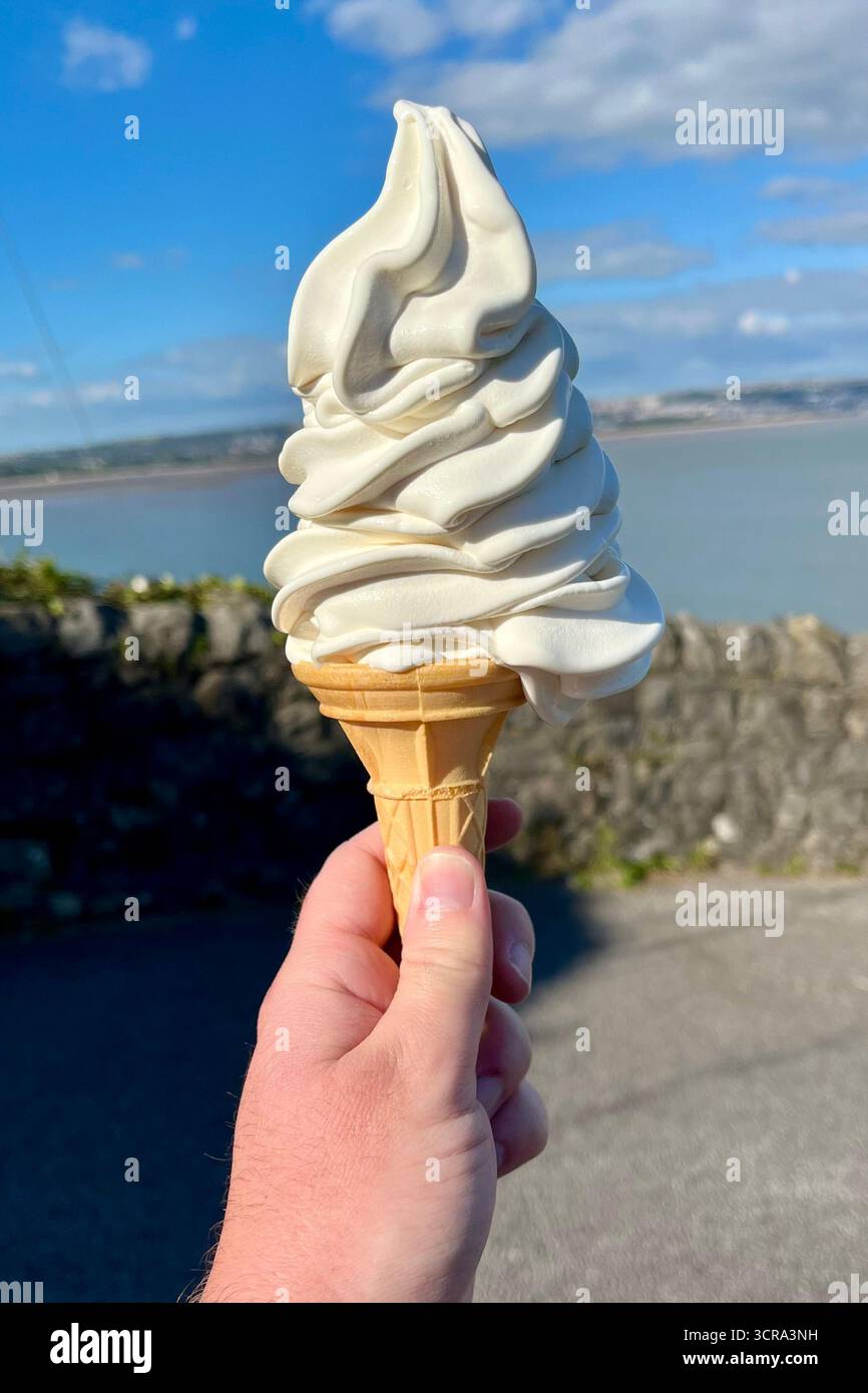 Hand holding mr whippy ice cream cone hi-res stock photography and ...